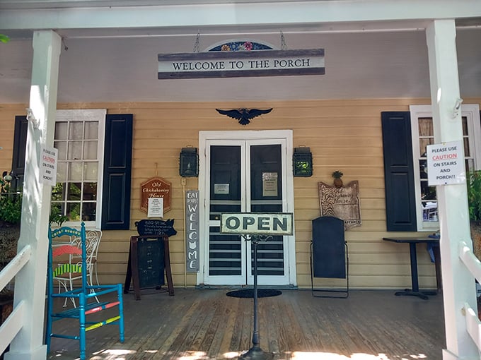 The welcoming yellow porch says "slow down" before you even walk through the door. Southern hospitality in architectural form.