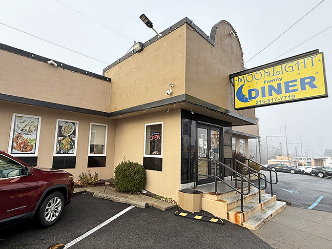 The iconic blue sign of Moonlight Family Diner glows like a beacon for hungry travelers. Pennsylvania's answer to midnight cravings and morning salvation.