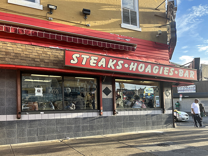 The iconic yellow and red fa&ccedil;ade of Max's Steaks stands as a beacon of culinary authenticity on North Broad Street, promising Philadelphia's ultimate comfort food experience.
