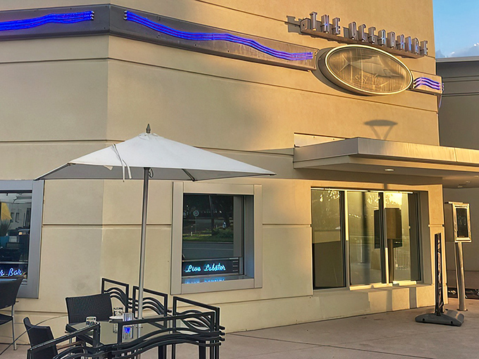 The blue glow of The Oceanaire's iconic sign promises maritime delights within&mdash;like a lighthouse guiding hungry sailors to culinary treasure.