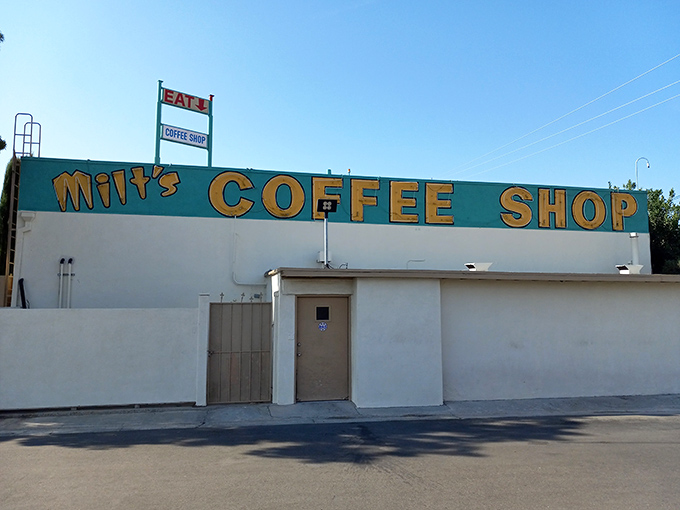 Milt's iconic red roof and vintage sign stand as a beacon of hope for hungry travelers on Bakersfield's horizon.