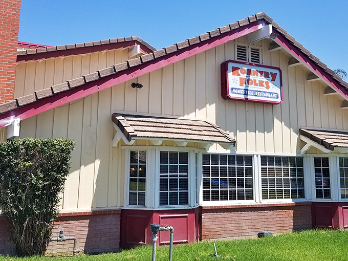 The charming cream-colored exterior with distinctive red trim promises homestyle comfort without pretension. A roadside beacon for breakfast lovers.