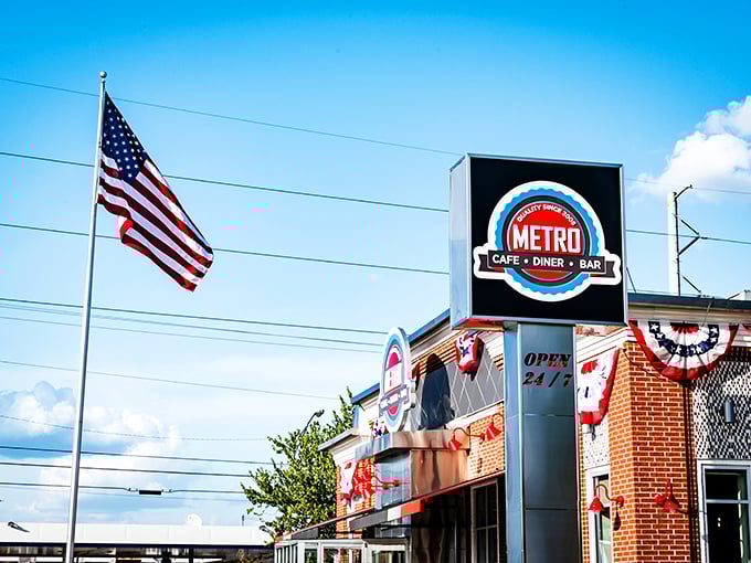 The iconic red and white exterior of Metro Cafe Diner stands like a beacon of comfort food against Stone Mountain's blue sky.