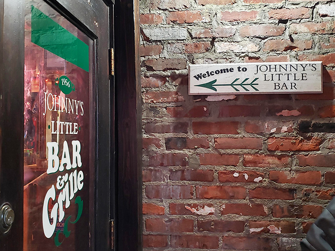 The unassuming entrance to burger paradise. Johnny's Little Bar hides behind this modest door, proving great food doesn't need flashy signage to be legendary. 