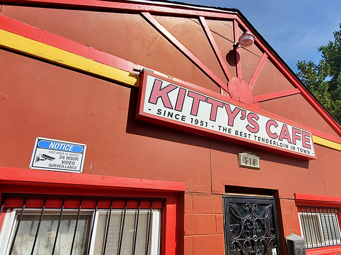 The little red building that could! Kitty's Cafe stands proudly on 31st Street, a humble architectural statement making bold culinary promises.