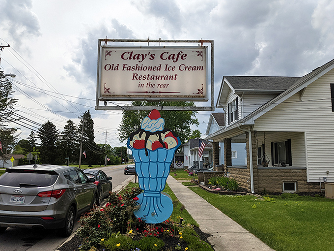 That cheerful ice cream sundae sign outside promises sweet endings to every savory beginning.