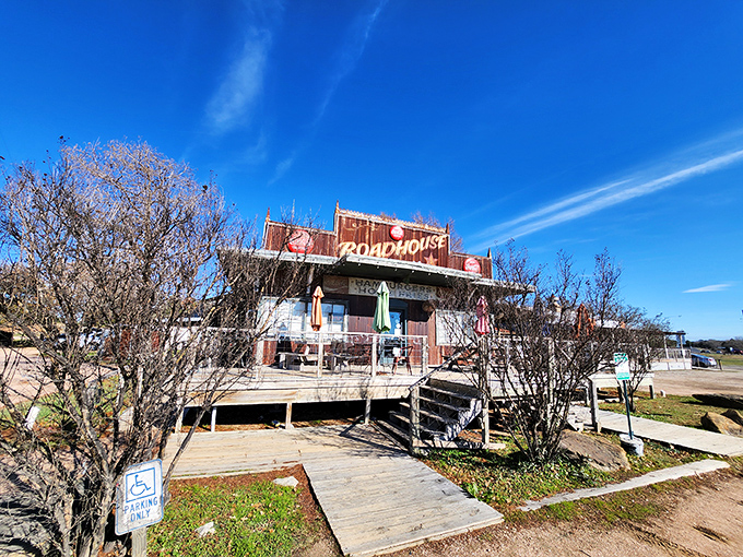 Like a Texas time machine with a wooden boardwalk entrance, Roadhouse stands proudly against that impossibly blue Bastrop sky, promising honest food and zero pretension.