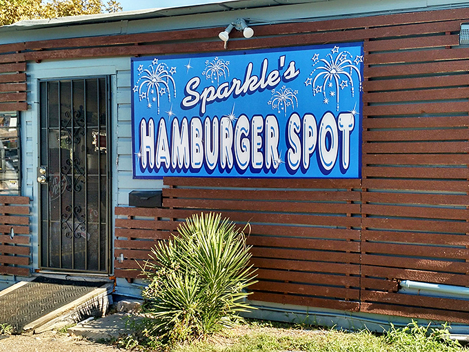 The blue sign with fireworks says everything: this place celebrates every burger like the Fourth of July.