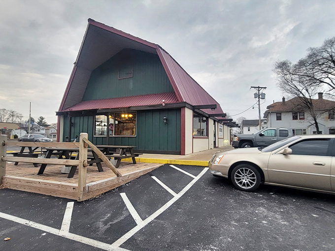 The distinctive A-frame green building with red trim stands like a culinary lighthouse beckoning hungry travelers to Dayton's hidden gem.