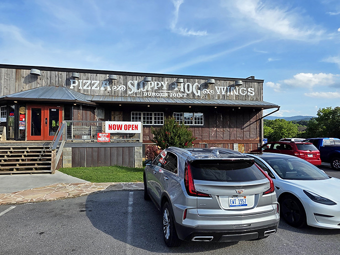 The rustic wooden exterior of Sloppy Hog stands like a delicious mirage against the Smoky Mountain backdrop, promising comfort food that'll make your cardiologist wince with delight.