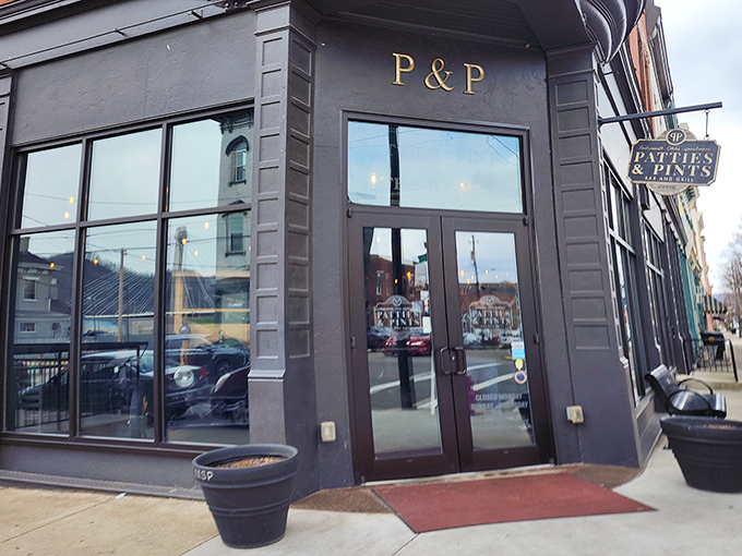 The corner entrance to Patties & Pints glows with promise as dusk settles, like a beacon calling all hungry travelers home to burger paradise. 