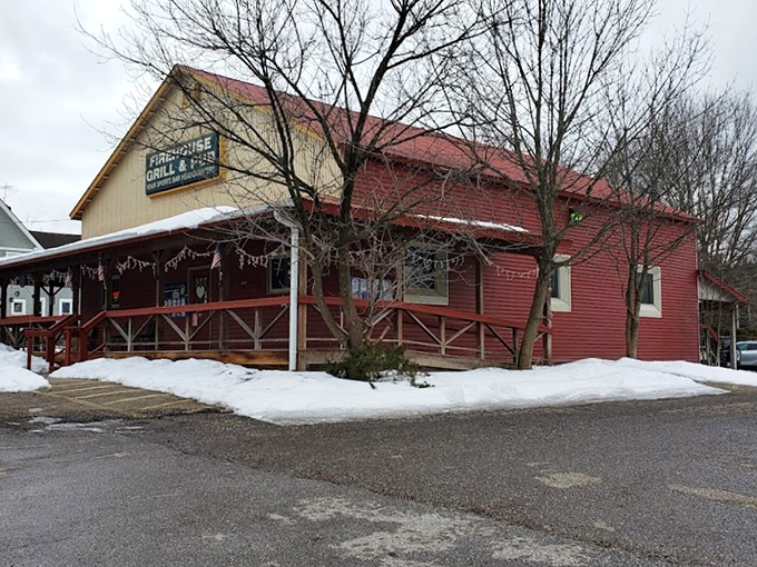 The red exterior of Rootstown Firehouse Grille & Pub stands like a beacon for hungry travelers, promising comfort and satisfaction within its welcoming walls.