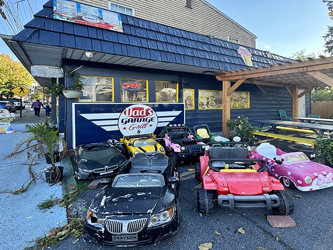 The blue exterior of Dad's Garage isn't just a restaurant&mdash;it's a time machine with kid-sized cars that'll make you wish you were eight again.
