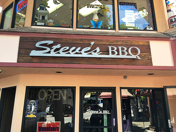The inviting exterior of Steve's BBQ glows with string lights, creating that "you've just discovered something special" atmosphere in Whittier.