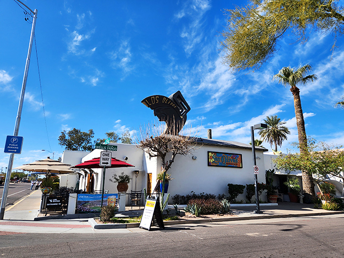The pristine white walls of Los Olivos stand like a desert mirage, promising culinary treasures within. The vibrant bougainvillea adds that perfect pop of color.