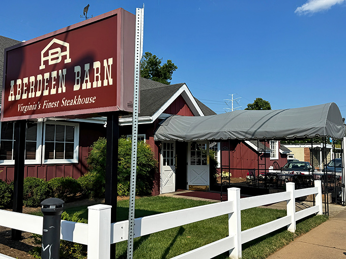 The barn-red exterior with white trim isn't just charming&mdash;it's a promise of the comfort food paradise waiting inside. String lights add a touch of magic to outdoor dining.