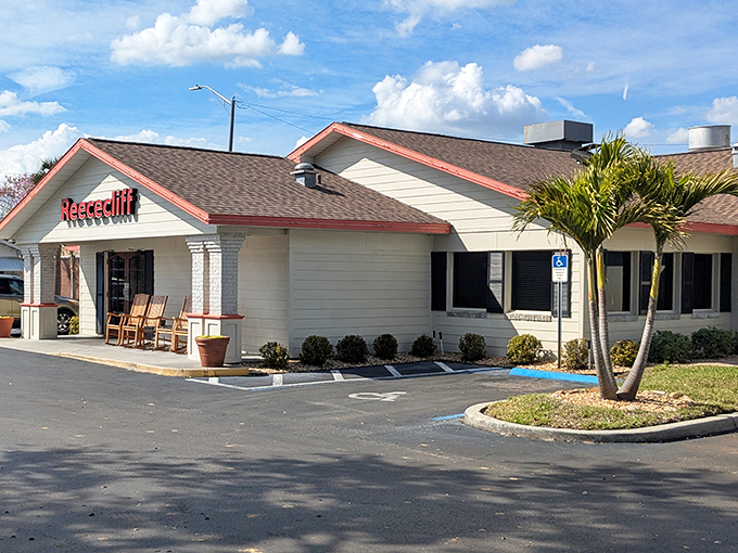 The iconic white exterior with red trim and wooden rocking chairs says "slow down, friend&mdash;good food takes time."