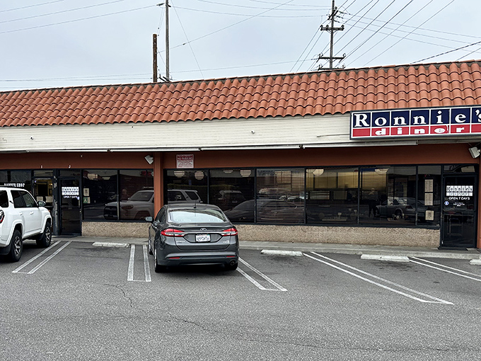 Hiding in plain sight, Ronnie's Diner's modest exterior with its terracotta roof tiles conceals breakfast magic that locals have treasured for years.