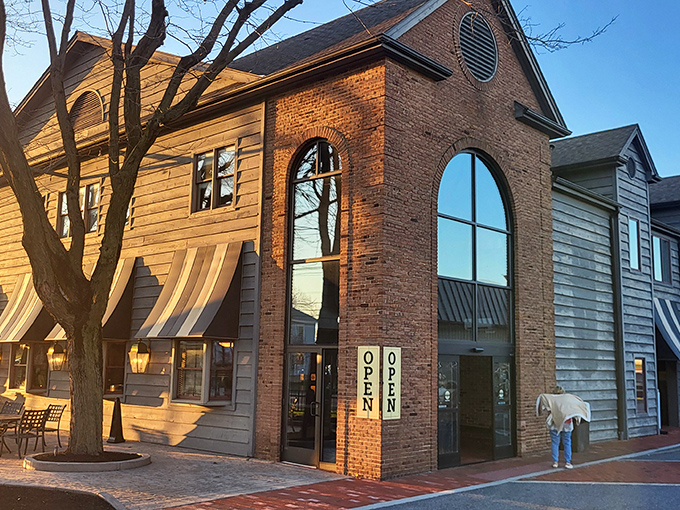 The brick-and-wood exterior of Miller's Smorgasbord stands like a delicious promise at the crossroads of tradition and comfort food paradise.