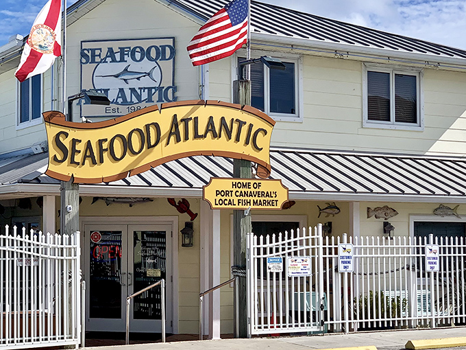 The unassuming exterior of Seafood Atlantic stands like a beacon for seafood lovers, with its cheerful yellow sign promising treasures from the deep.