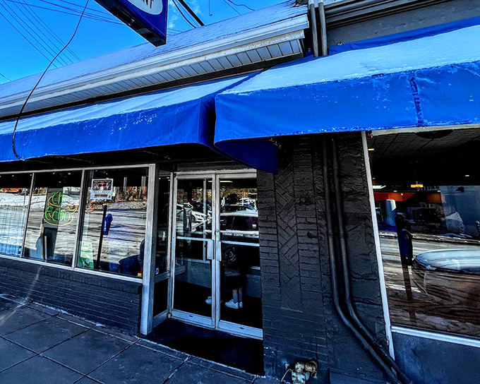 The blue awnings of The Echo beckon like an old friend on Cincinnati's Edwards Road, promising comfort food and zero pretension