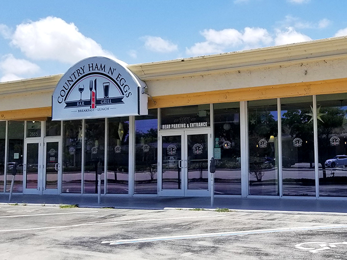 The unassuming storefront of Country Ham N' Eggs might not stop traffic, but locals know this Fort Lauderdale gem houses breakfast treasures worth their weight in liquid gold (coffee, that is).