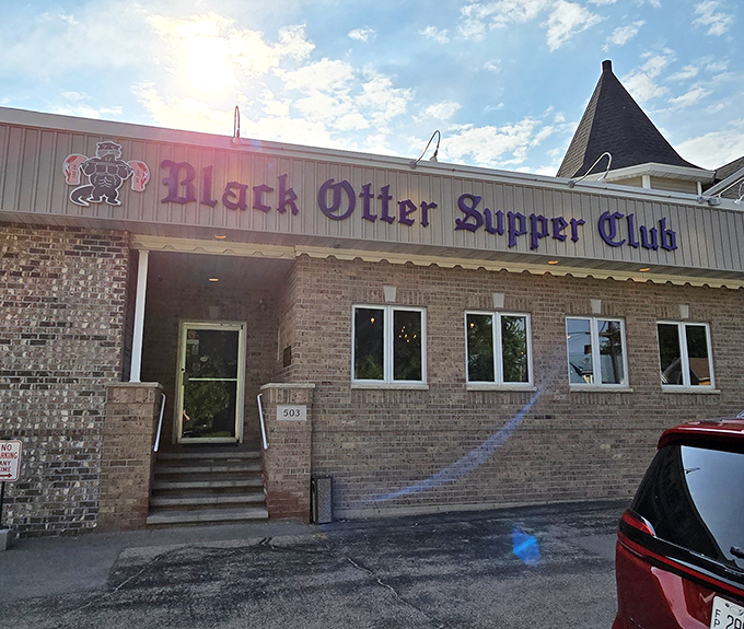 The purple sign beckons like an old friend against the brick facade. Wisconsin supper club perfection awaits inside this Hortonville treasure.