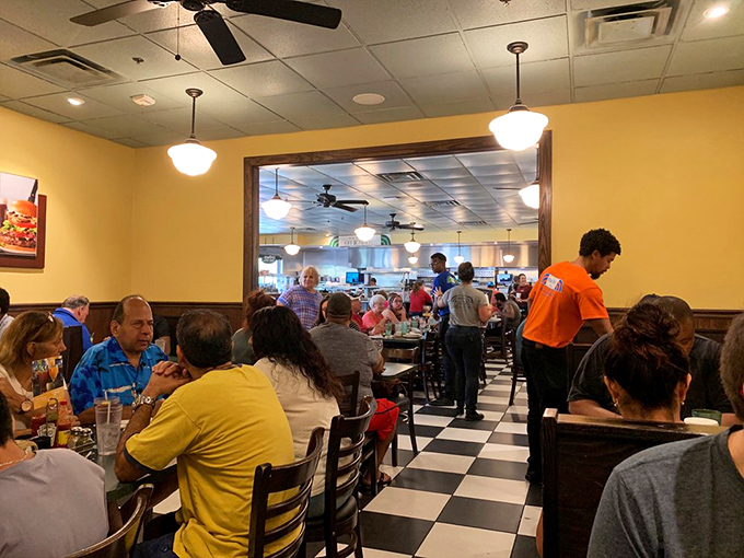 Metro Diner's bustling interior showcases its classic checkerboard floors and warm lighting, where locals and visitors gather for comfort food worth waiting for.