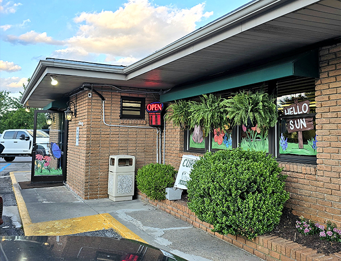The unassuming brick exterior of Clyde's might not scream "culinary destination," but those hanging ferns and colorful windows whisper, "Come on in, hungry traveler."