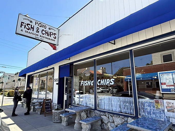 The unassuming exterior of Pismo Fish & Chips stands like a culinary lighthouse on the California coast, its blue awning a beacon for seafood lovers.