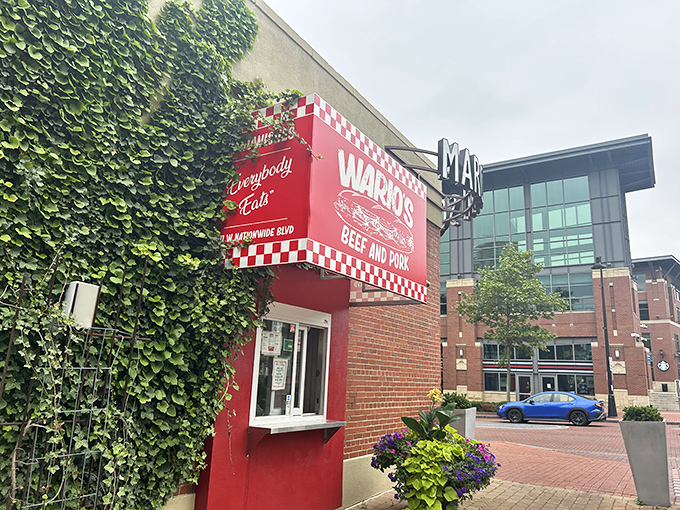 That unmistakable pink-and-red checkered facade isn't just eye-catching—it's a beacon of sandwich salvation nestled against ivy-covered brick on Nationwide Boulevard.
