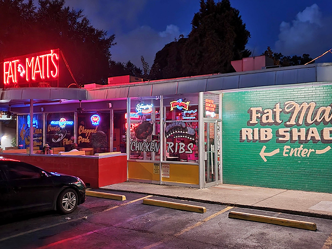 The unassuming green exterior of Fat Matt's might not scream "culinary landmark," but that SweetWater mural whispers, "locals know better."