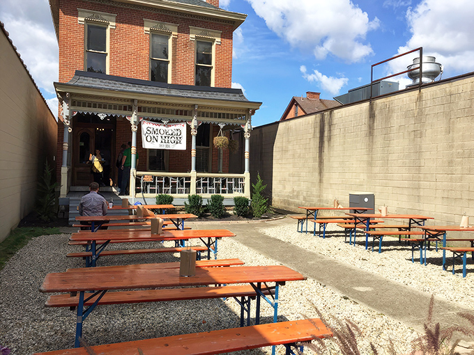 Victorian charm meets barbecue brilliance in this historic brick building. The yellow umbrellas practically scream, "Come get happy on our patio!"