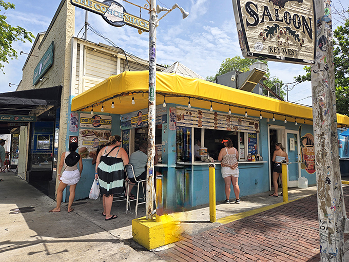 That turquoise paint job isn't just a color choice – it's a beacon calling hungry souls to seafood salvation.