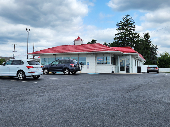 The iconic red roof of Speck's Drive-In stands as a beacon of comfort food promise in Collegeville, like a culinary lighthouse guiding hungry travelers home.