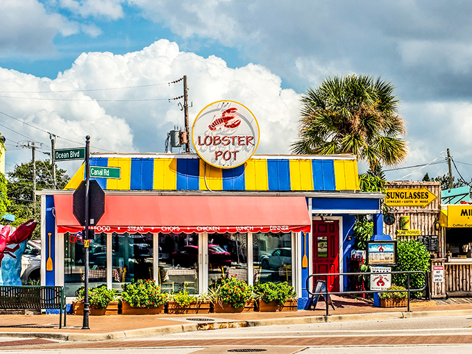 The iconic red awning of Lobster Pot beckons like a maritime flag signaling "deliciousness ahead." This unassuming Sarasota gem promises seafood treasures within.