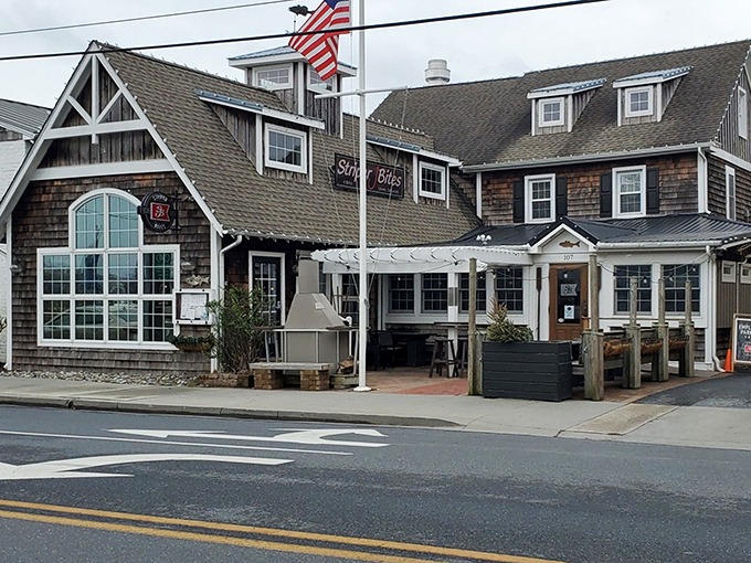 The quintessential coastal charm of Striper Bites welcomes you with its cedar-shingled exterior and nautical blue trim—like a postcard from seafood heaven.