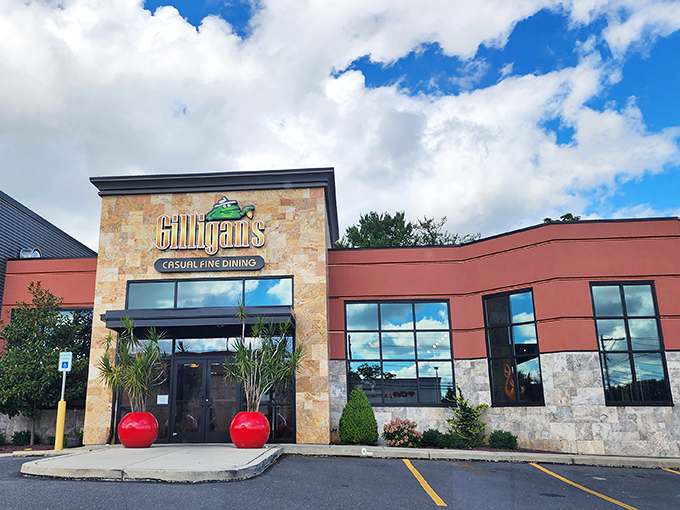 Gilligan's welcoming exterior promises culinary adventures ahead, with stone fa&ccedil;ade and bright red planters setting the stage for what's inside.