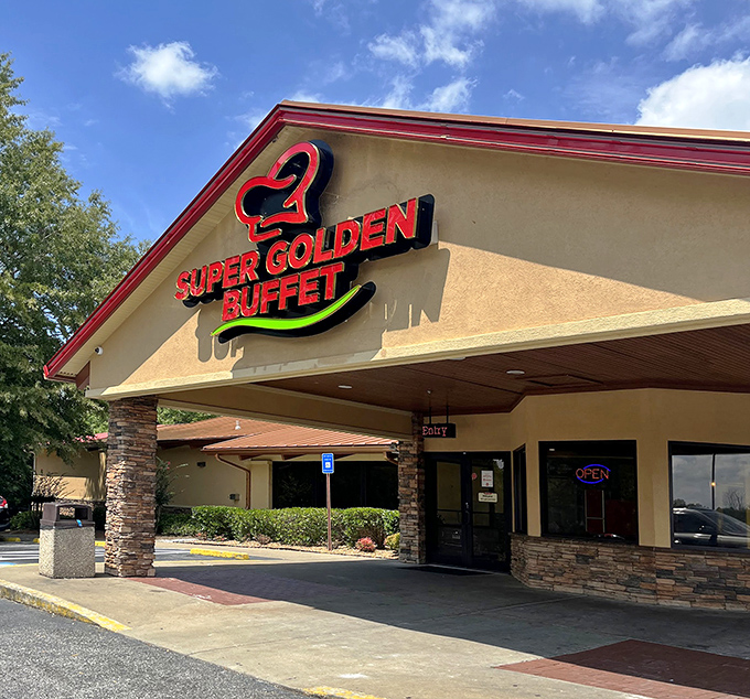 The stone facade of Super Golden Buffet beckons with its vibrant pink and green signage—like a neon promise of culinary abundance waiting inside.