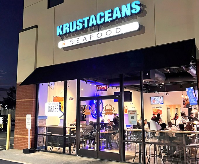 The blue glow of Krustaceans' sign beckons seafood lovers like a lighthouse calling ships to shore. Nashville's answer to coastal cravings.