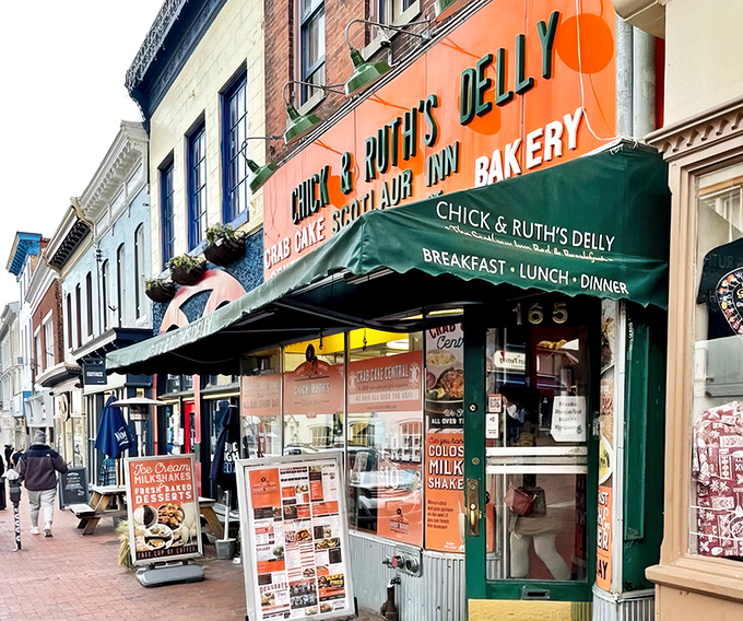 The iconic orange storefront of Chick & Ruth's Delly stands as a beacon of comfort food on Annapolis' Main Street, promising delicious memories in the making.