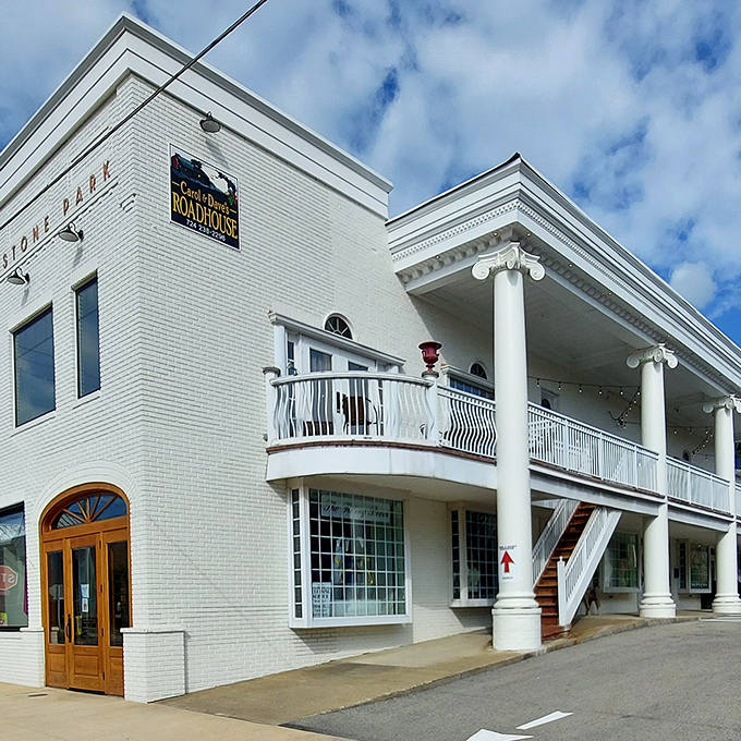 The stately white brick exterior of Carol & Dave's Roadhouse stands like a culinary lighthouse, beckoning hungry travelers with its elegant columns and promise of comfort food paradise.