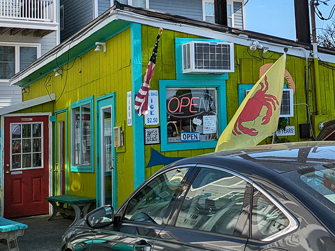 The lime-green exterior of Bahama's Crabshack stands out like a tropical oasis on Fenwick Island, beckoning seafood lovers with its unmistakable charm and vibrant personality.
