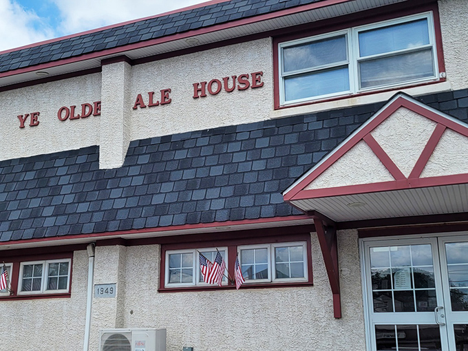 The unassuming exterior of Ye Olde Ale House stands like a culinary sentinel on Germantown Pike, promising comfort and satisfaction behind its Tudor-inspired facade.