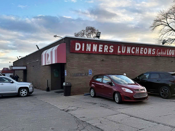 The unassuming exterior of Loui's Pizza proves once again that culinary treasures often hide in plain sight. Michigan's pizza pilgrims know: it's what's inside that counts.