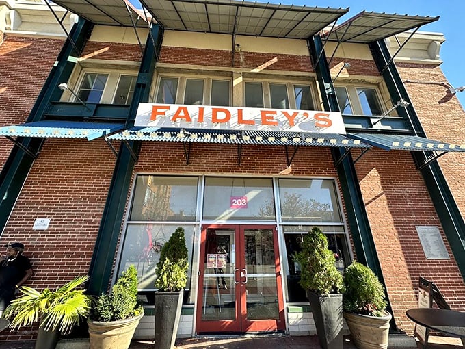 The iconic blue awning of Faidley's stands like a beacon for seafood pilgrims. Baltimore's culinary cathedral has been converting the uninitiated for generations.