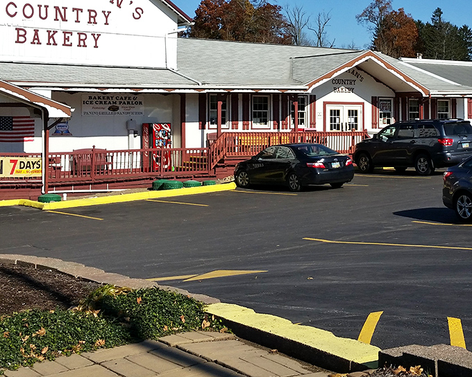 The charming exterior of Kauffman's Country Bakery welcomes visitors with its classic red-trimmed porch and rustic wooden railings&mdash;Amish Country's version of a sweet-tooth embassy.