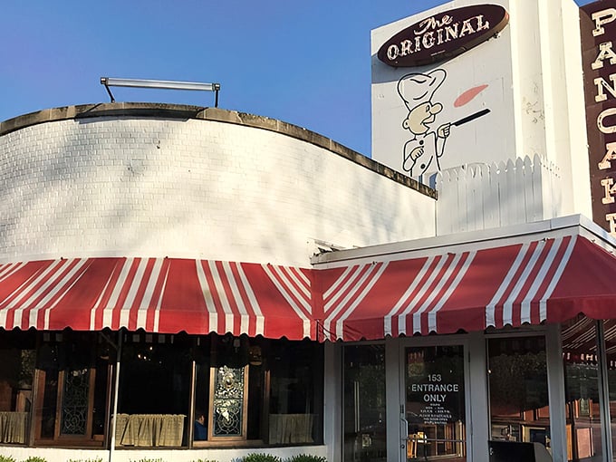 The iconic white building with red-and-white striped awnings stands like a beacon of breakfast hope on Wilmette's Green Bay Road.