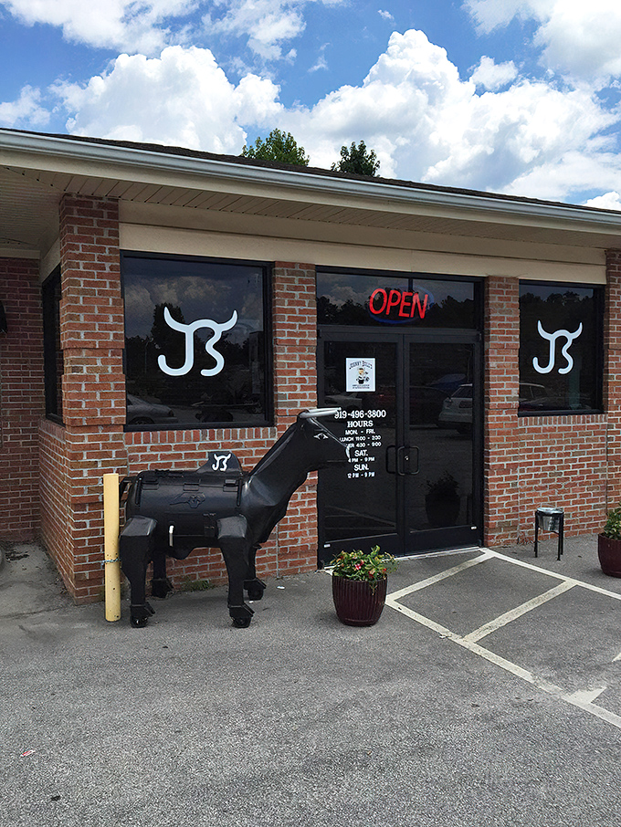 The unassuming brick exterior of Johnny Bull's Steakhouse hides culinary treasures that locals have been quietly enjoying for years.
