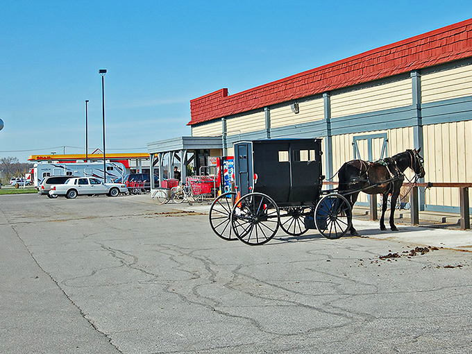 Where worlds collide! Amish buggies and railroad tracks create the perfect metaphor for Nappanee's unique blend of traditional values and modern convenience.